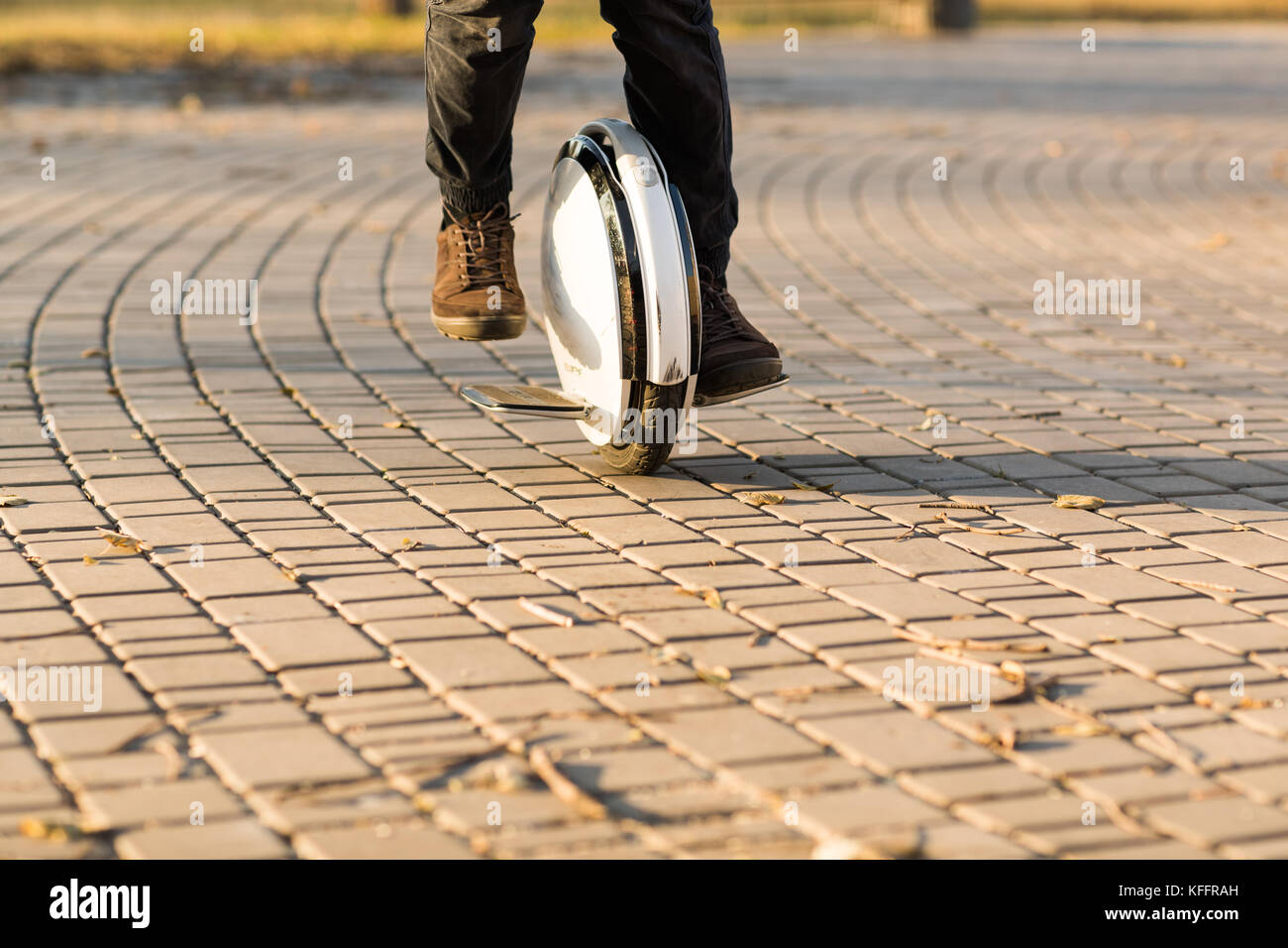 Man legs mono wheel personal electrical transport Stock Photo - Alamy