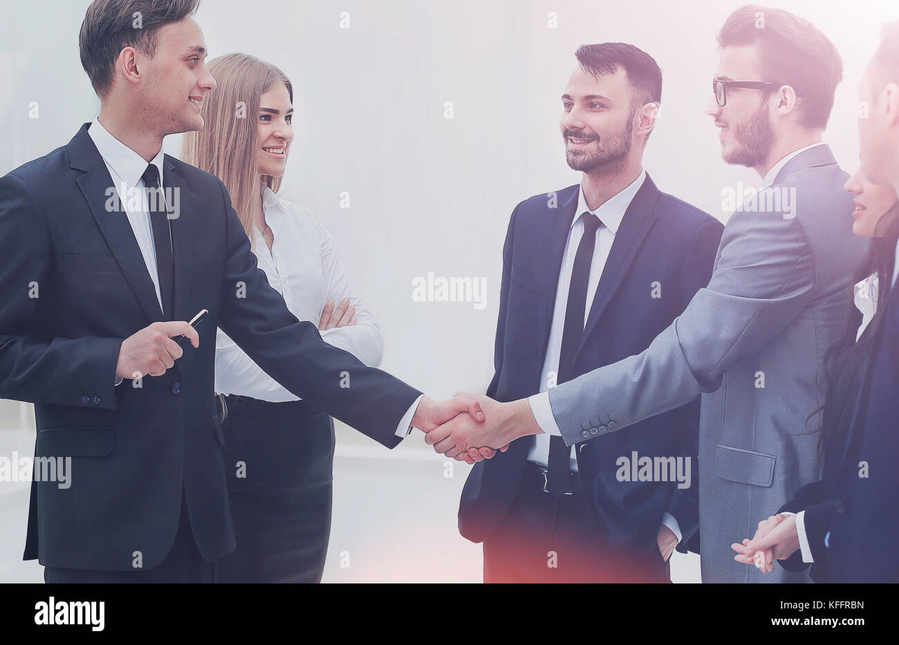 Successful businessmen handshaking after presentation Stock Photo - Alamy
