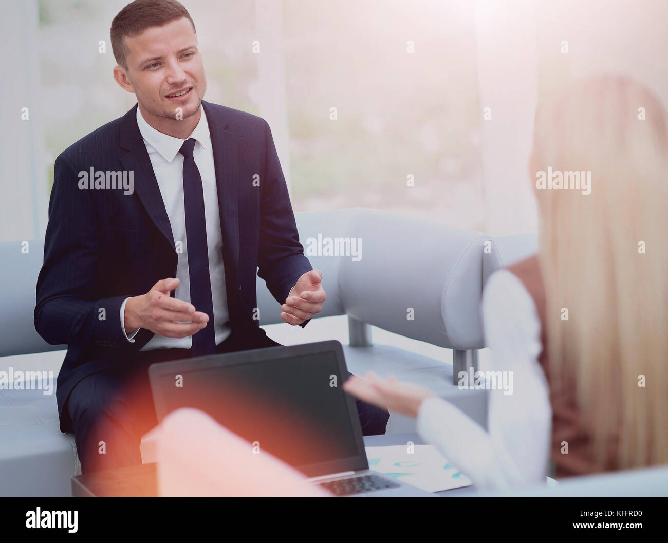 Young manager listening to his colleague explanations Stock Photo - Alamy
