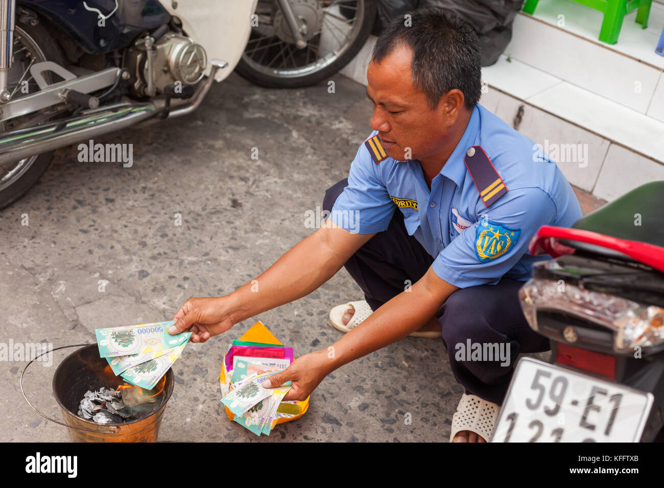 Burning money (Ghost/Votive money, Joss paper) in Vietnam Stock Photo ...
