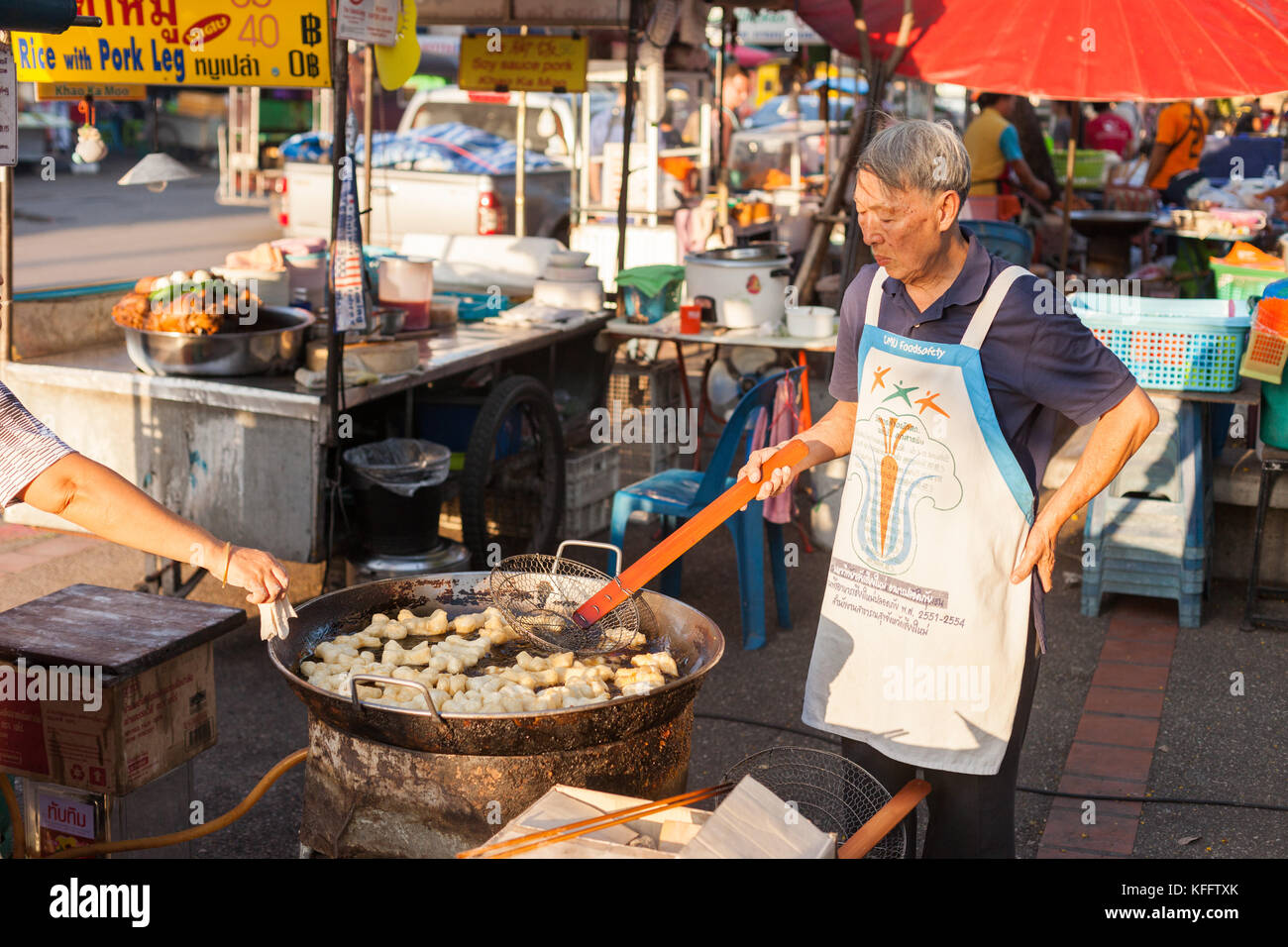 Street food vendor makes fried dough, Chiang Mai Gate Night Food Market ...