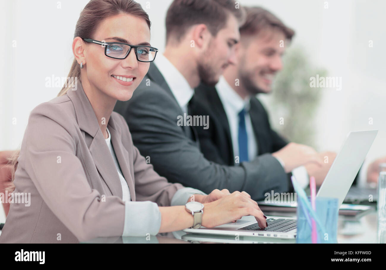 Business people working around table in modern office Stock Photo - Alamy