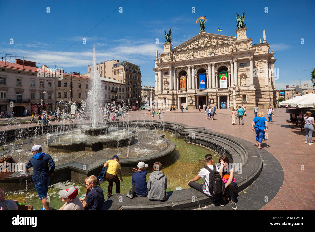 People at the fountain in front of the Lviv Theatre of Opera and Ballet ...