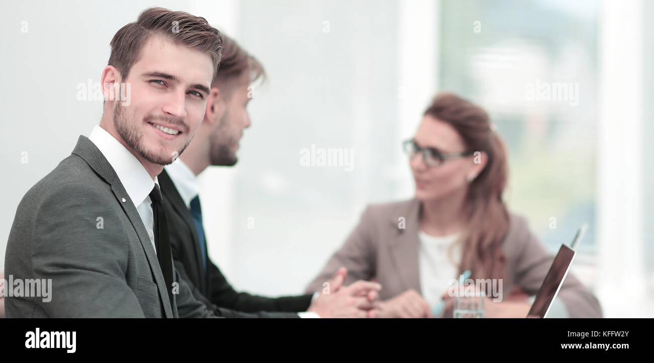 Business people working around table in modern office Stock Photo - Alamy