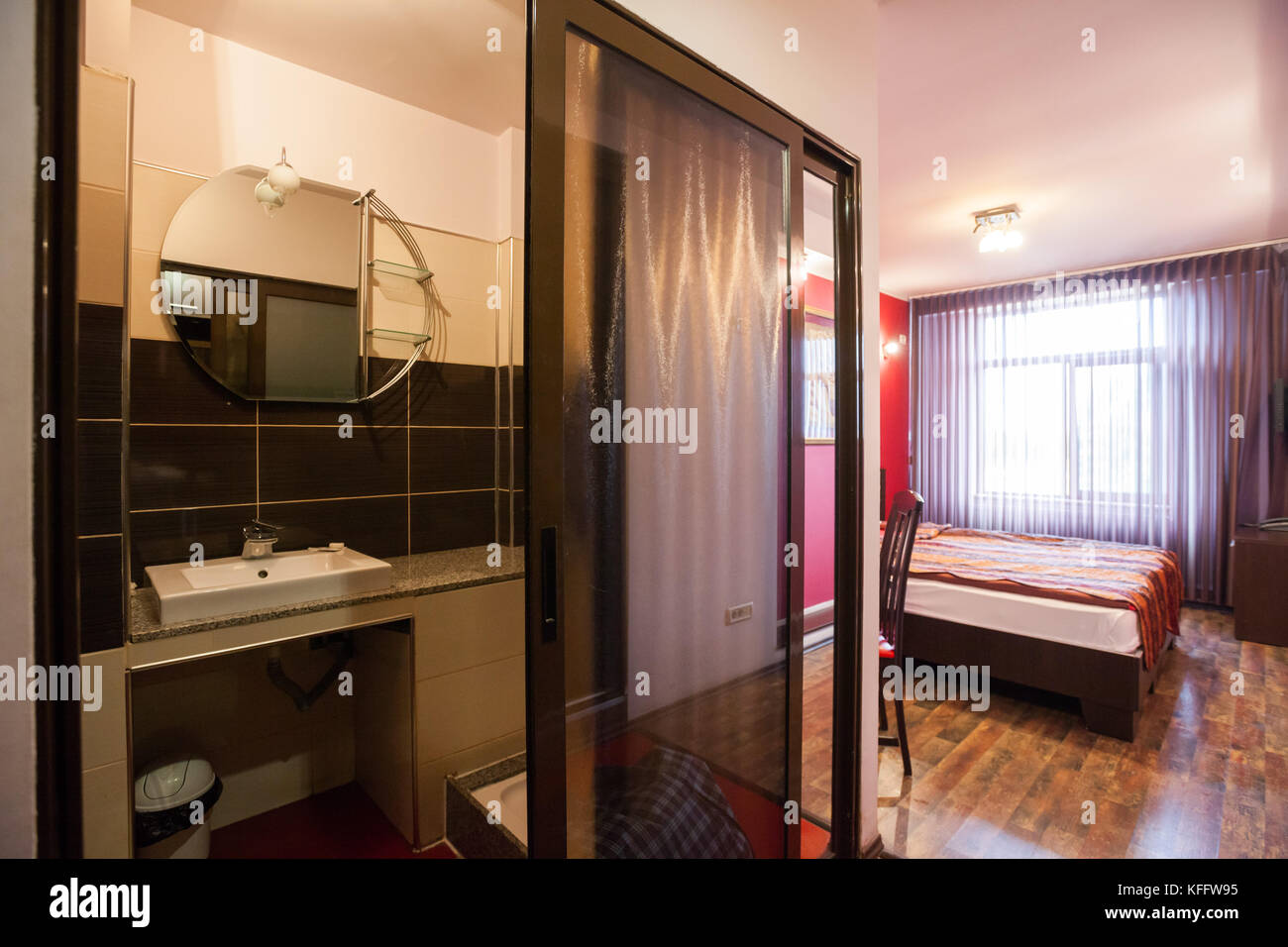 Upscale hotel room with red decor Stock Photo - Alamy