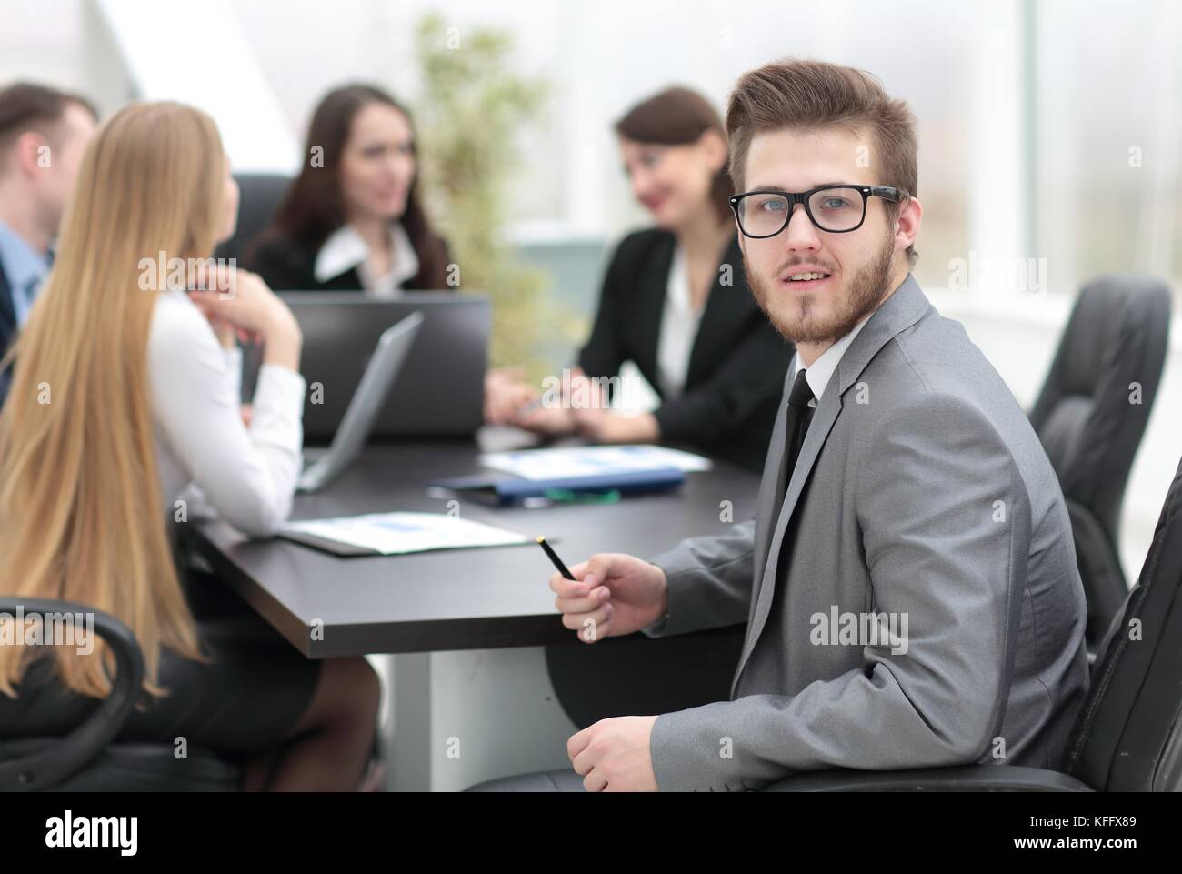 successful project Manager on the background of the office Stock Photo ...
