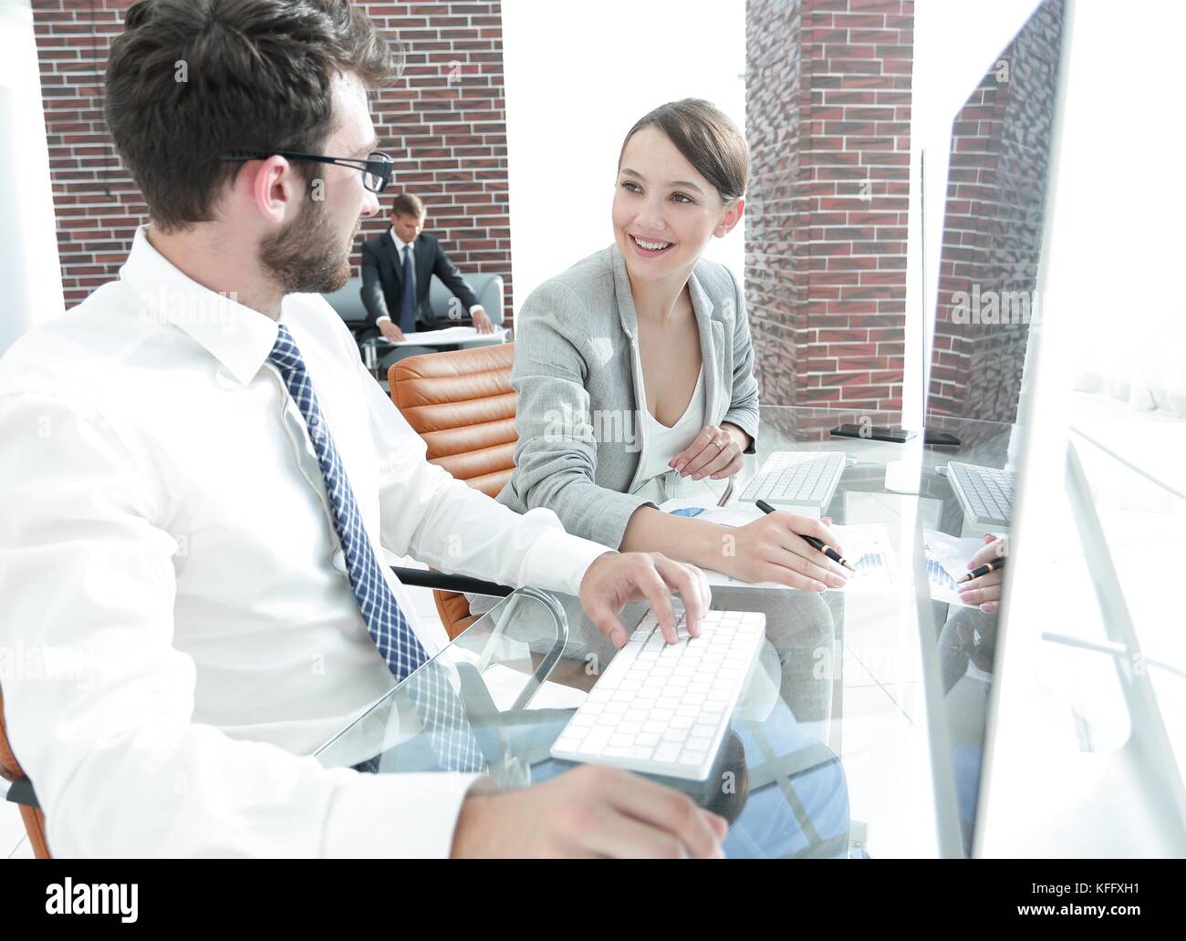 business background.young professionals sitting behind a Desk Stock ...