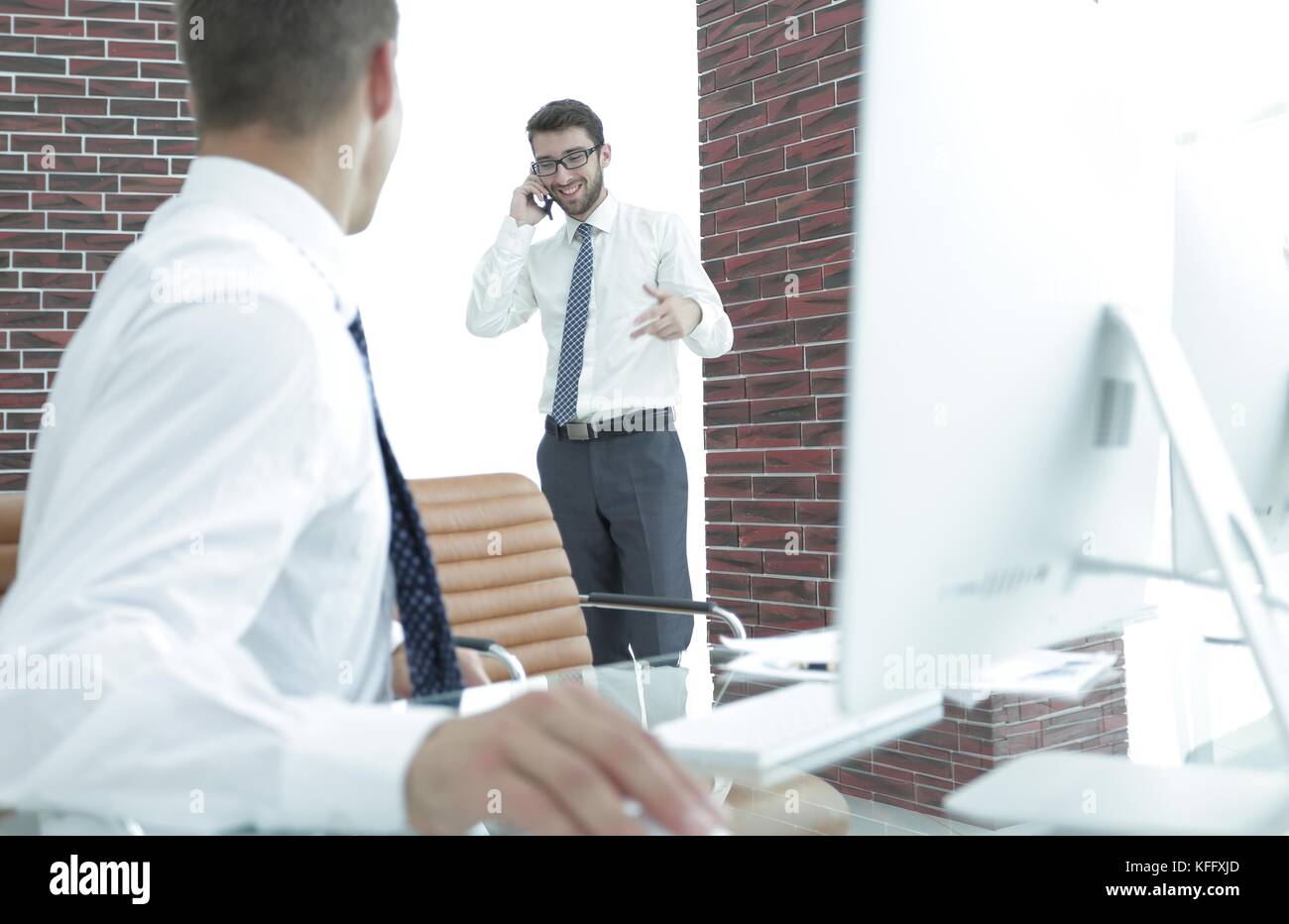 business background.employee talking on the smartphone Stock Photo - Alamy