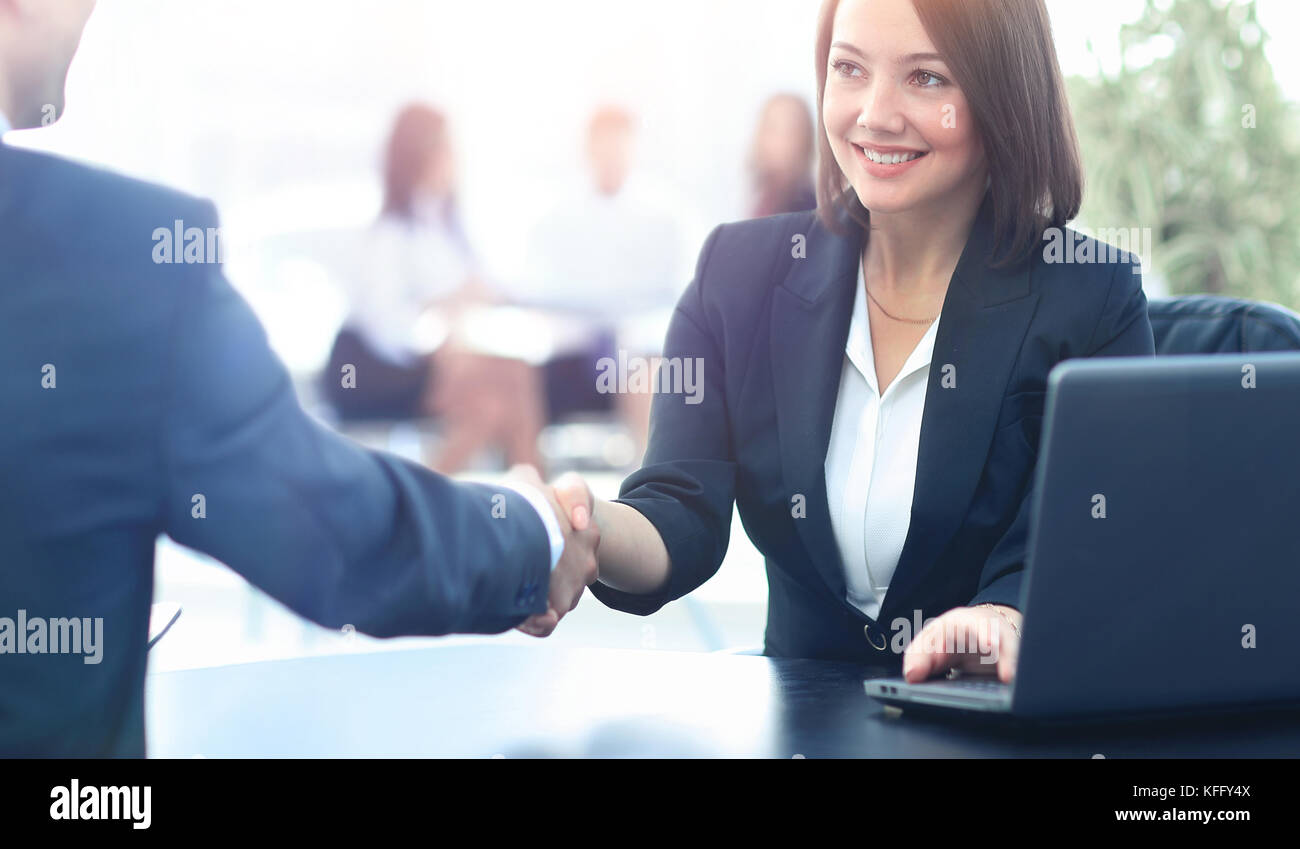 Two professional business people shaking hands Stock Photo - Alamy