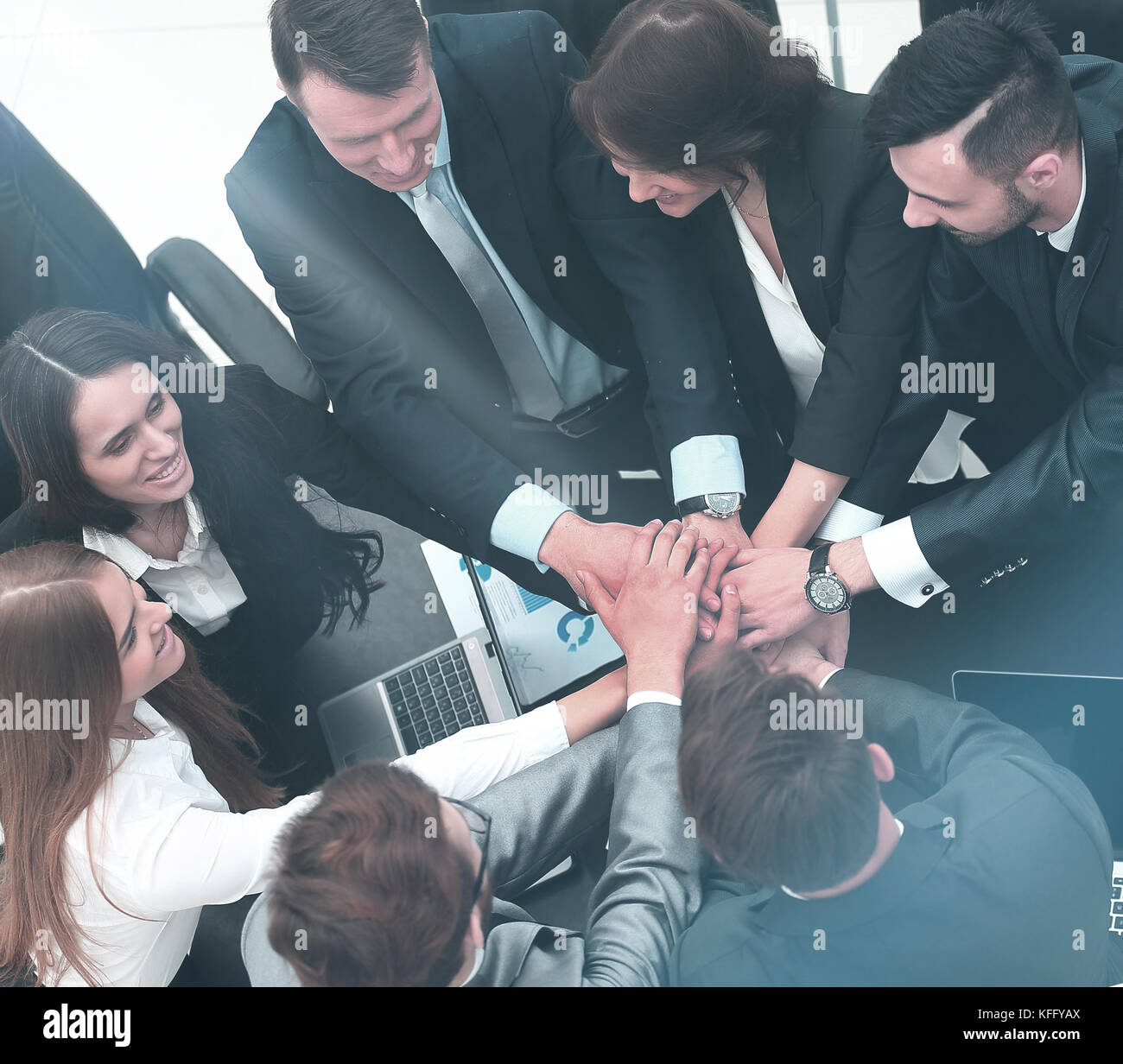 Business team showing unity with their hands together Stock Photo - Alamy