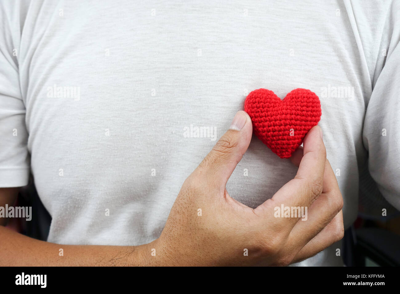 Hand heart shape on chest hi-res stock photography and images - Alamy