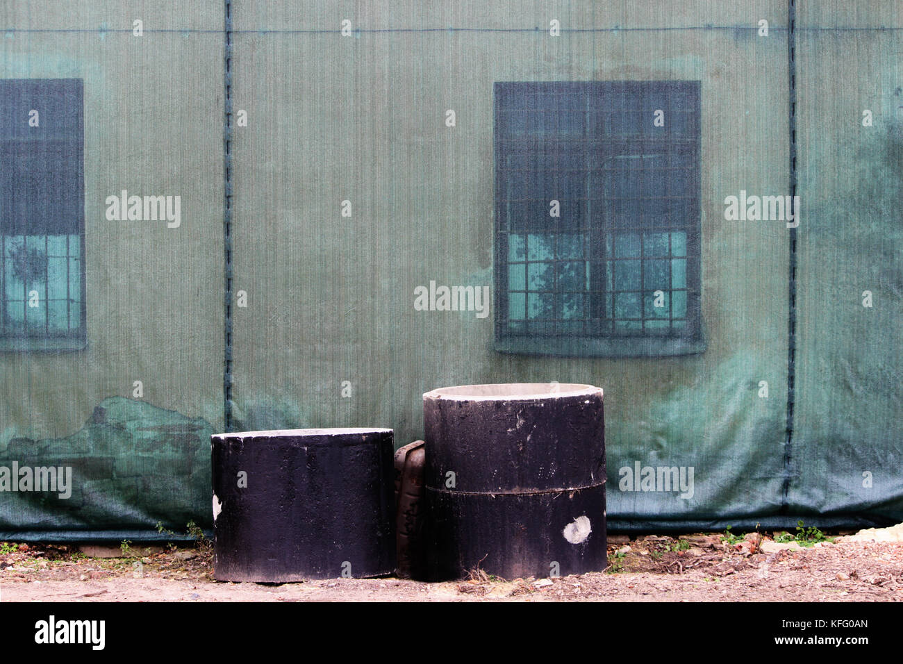 three concrete rings for stormwater on the background of a house ...