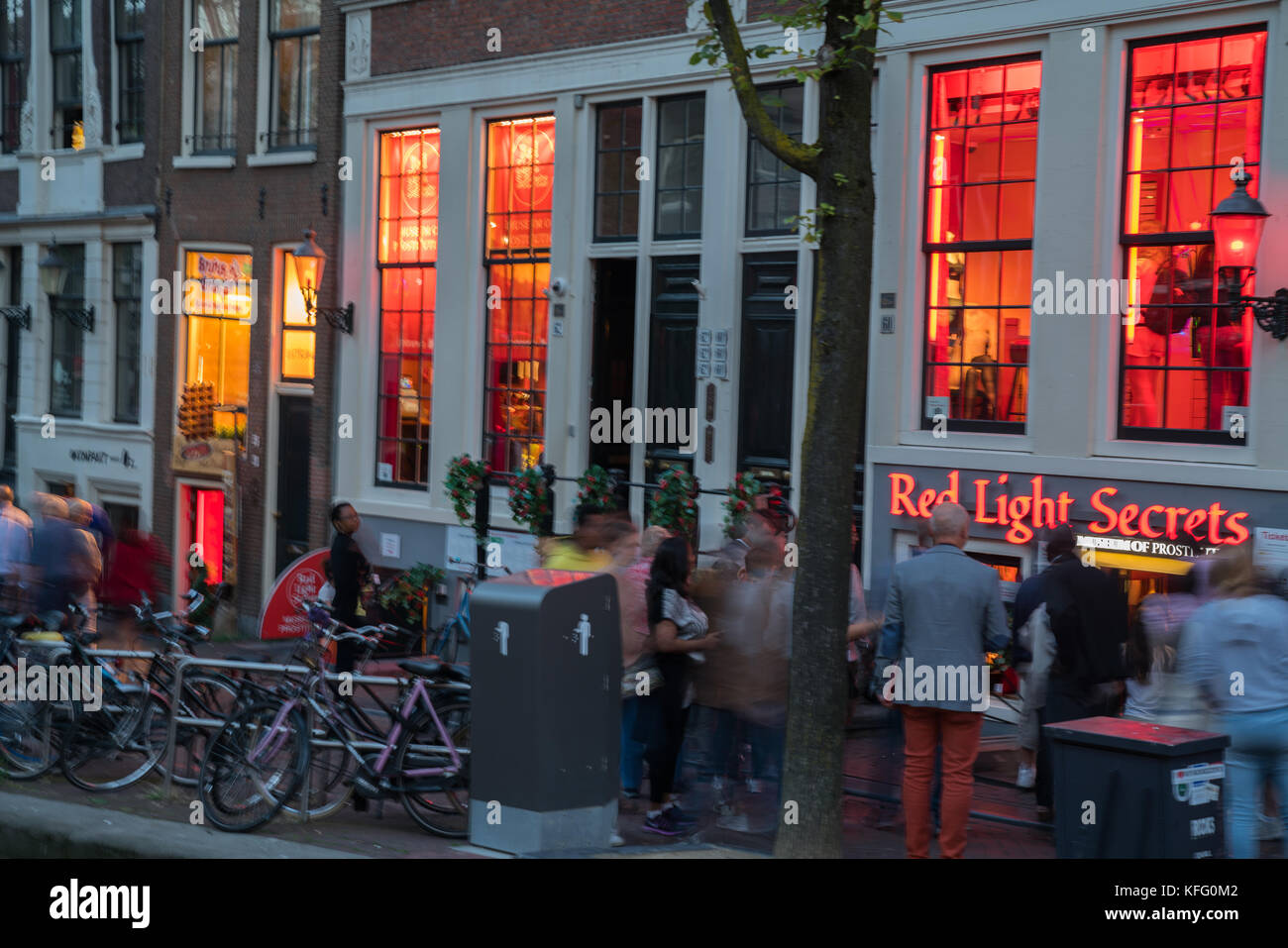 AMSTERDAM, HOLLAND - AUGUST 17, 2017; People and night lights along ...