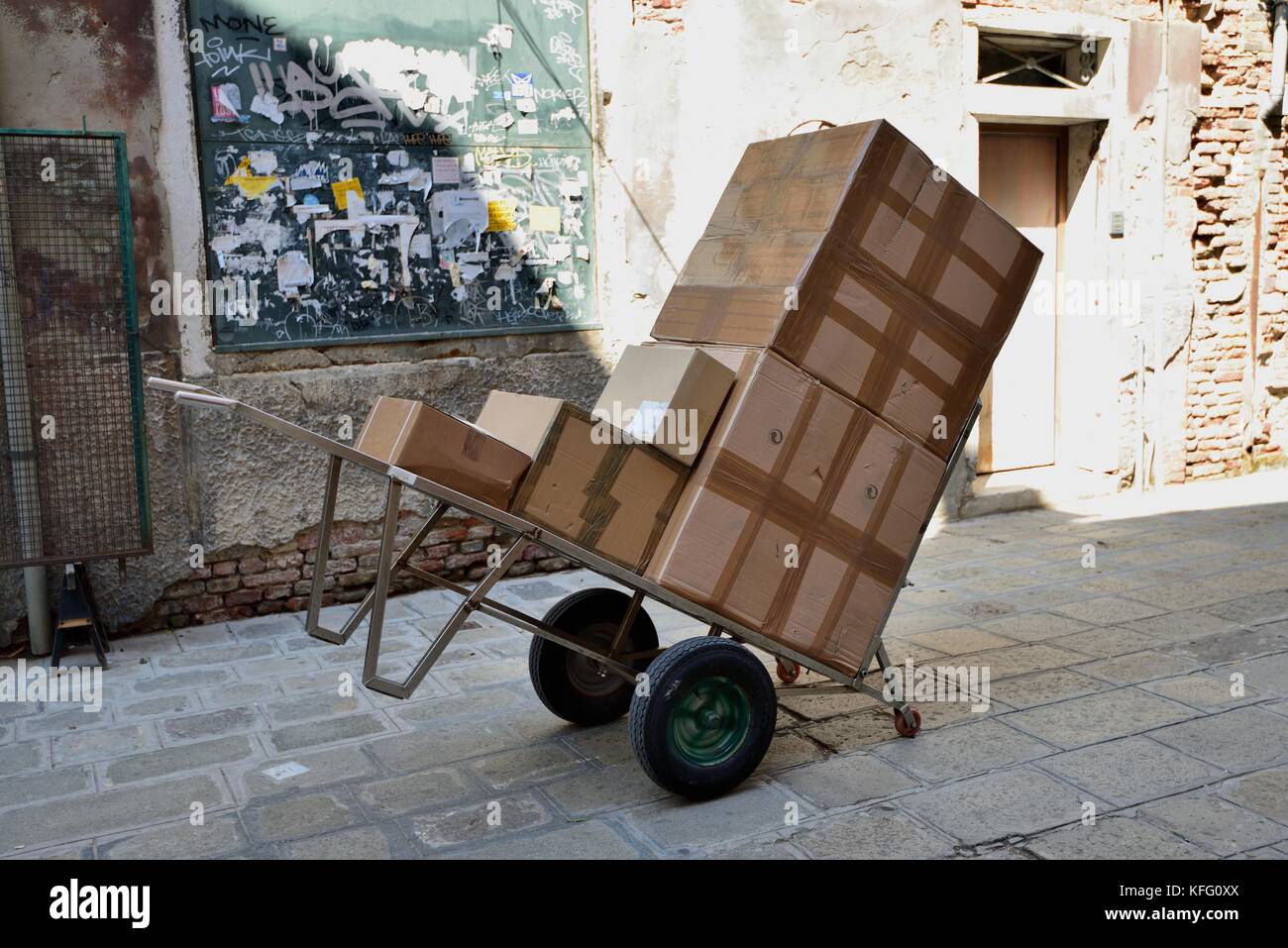 Boxes awaiting delivery in the streets of Venice in September 2017 Stock Photo - Alamy