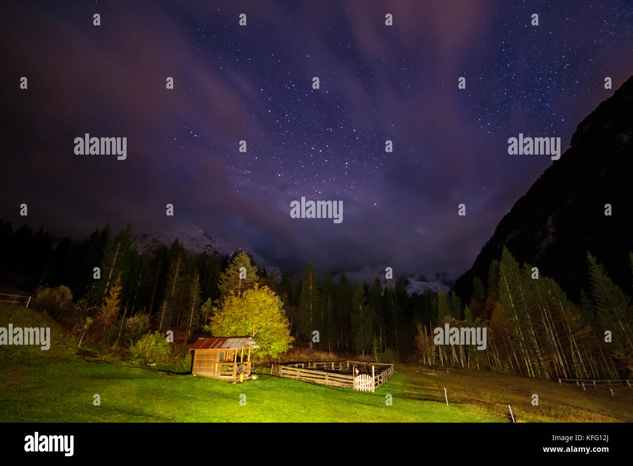 an alpine hut in the valley during a dark night Stock Photo - Alamy