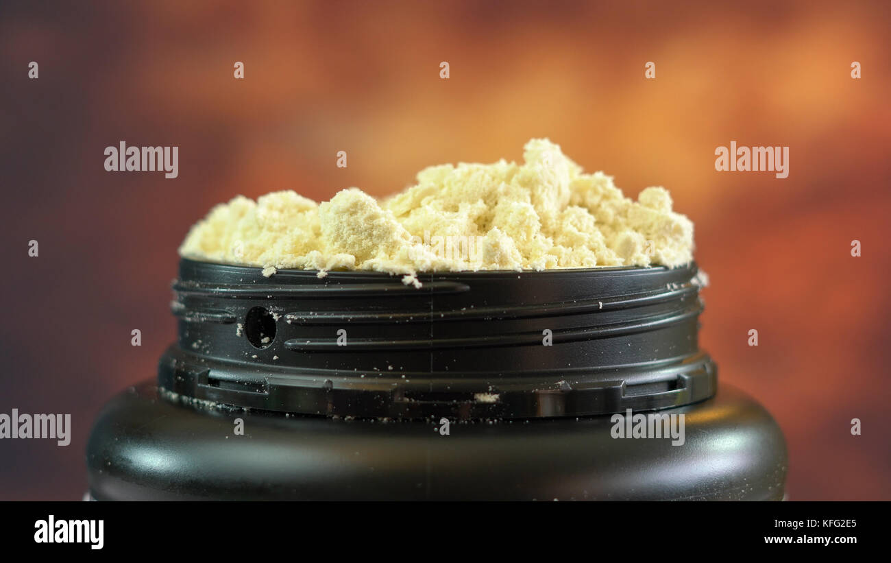 Macro close up of container of pure nutritional supplement whey protein ...