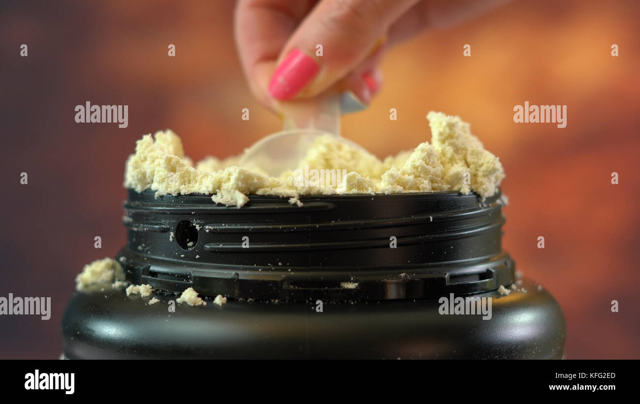 Macro close up of container of pure nutritional supplement whey protein ...