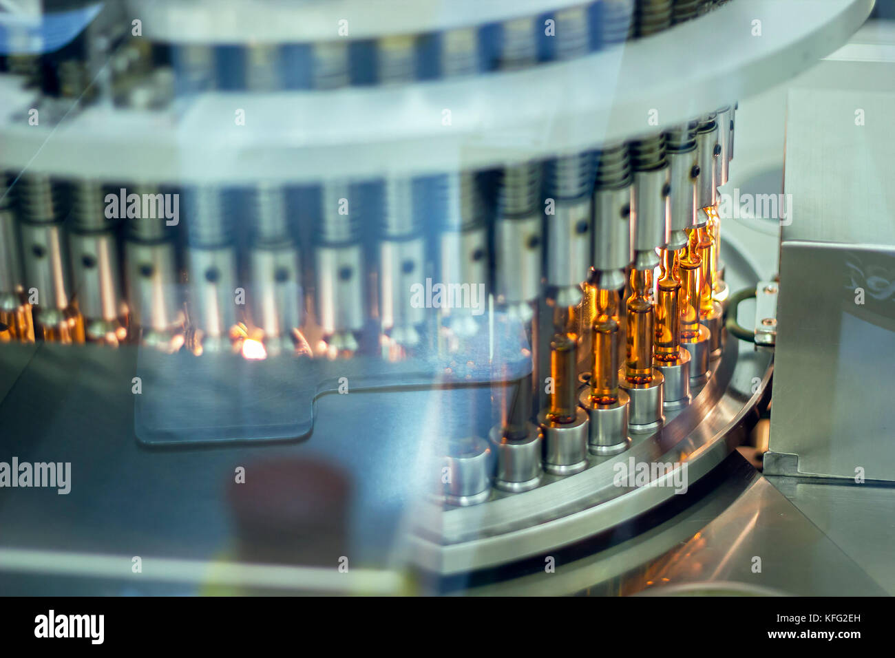 Inspects vials and ampules for particulates in liquid and container ...