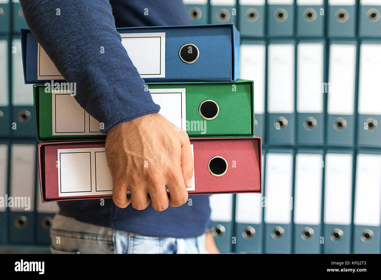 Man holding, corporate files in document binder Stock Photo - Alamy