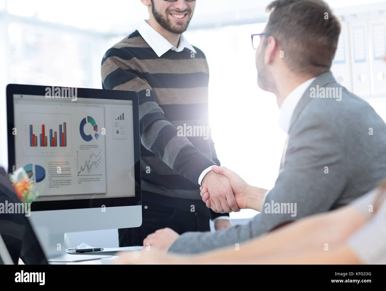 handshake Manager and the client in the office Stock Photo - Alamy