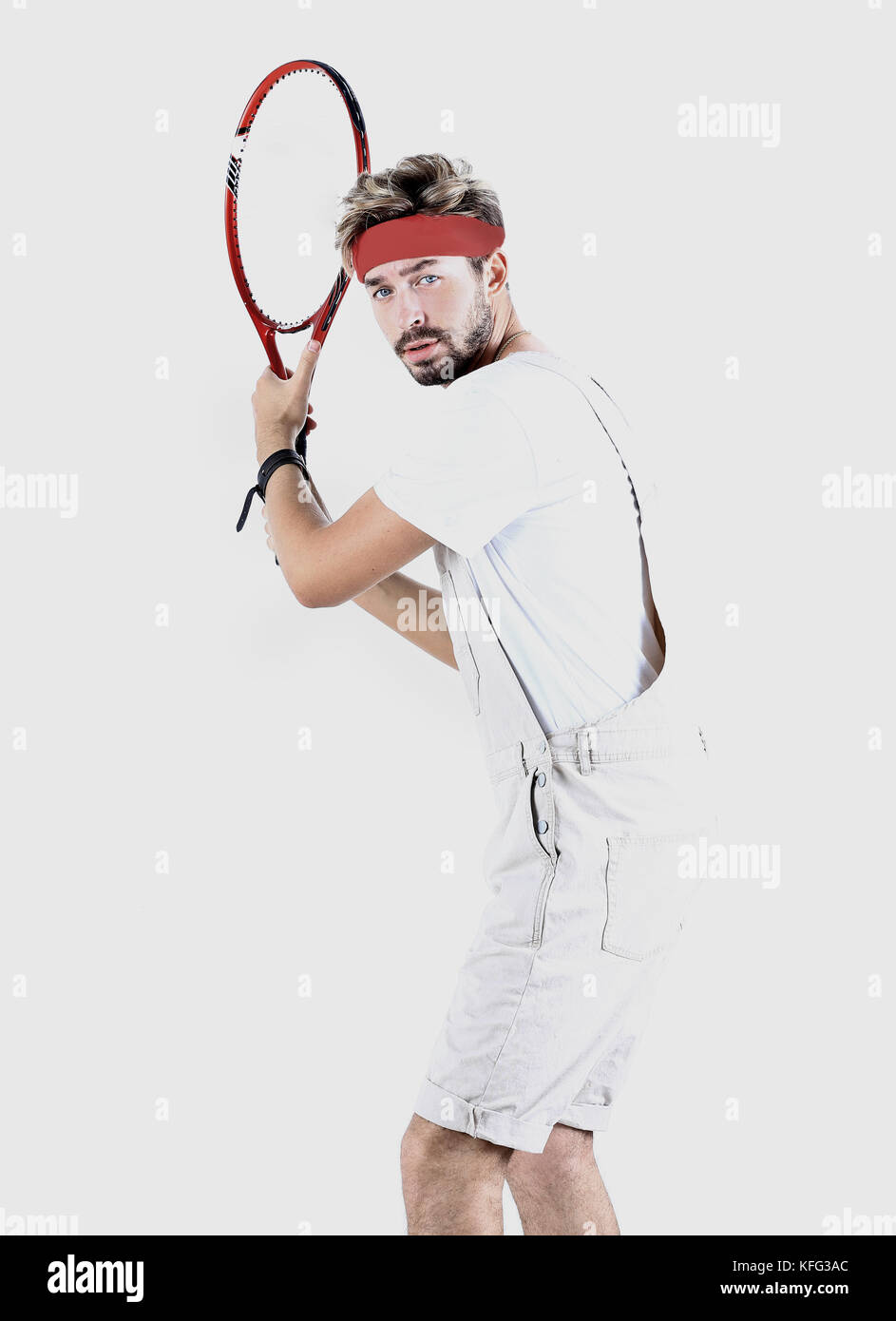 Full length portrait of a male tennis player holding a racket isolated ...