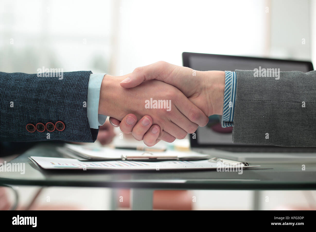 handshake of business partners after discussion of the financial Stock ...