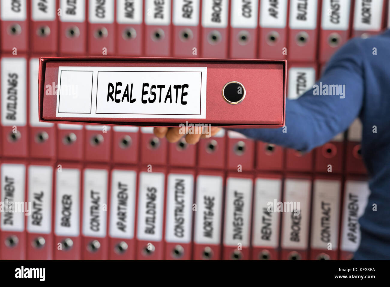 Real Estate concept. Young man holding ring binder Stock Photo - Alamy