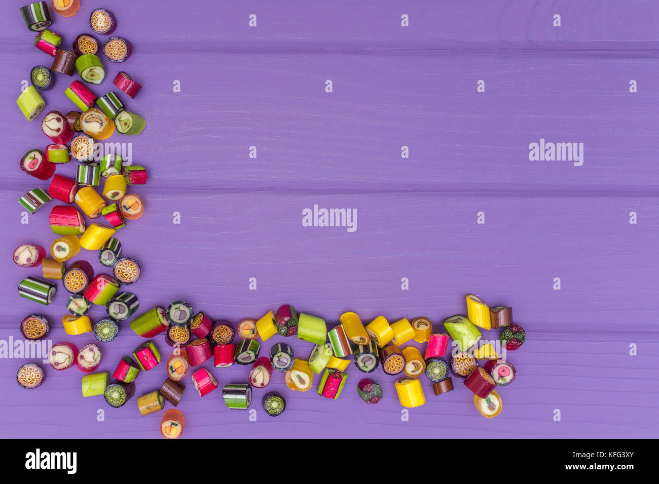 A corner frame made of colored caramel candies Stock Photo - Alamy