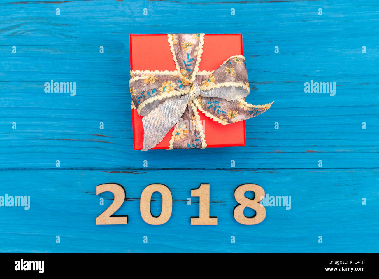 Gift box and numbers 2018 new year on blue wooden old table Stock Photo ...