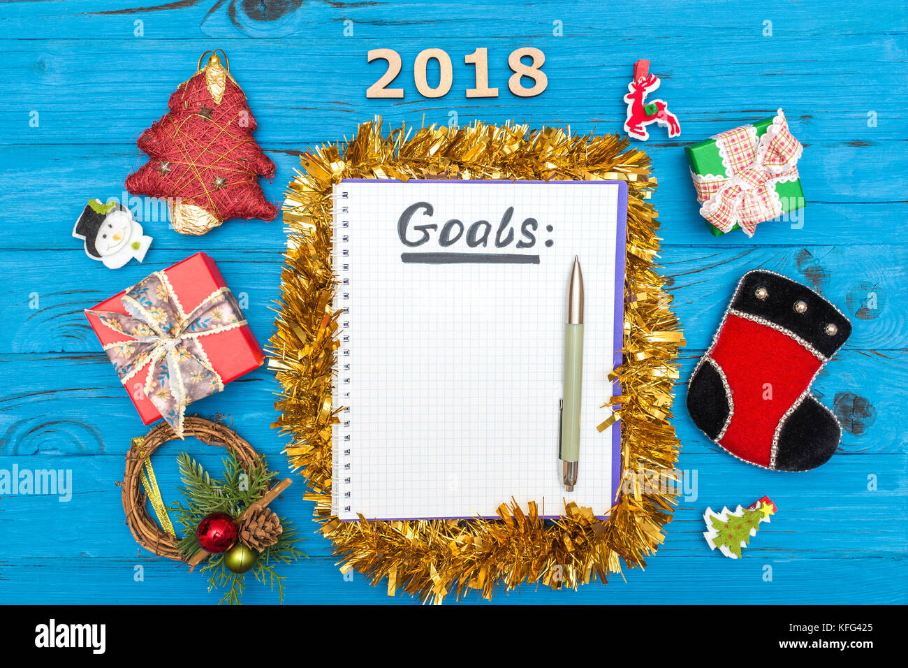 Notebook with new years goals for 2018 with a pen and numbers 2018 ...