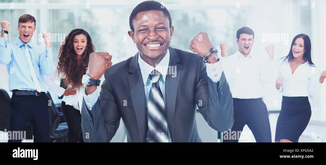 Business team celebrating a triumph with arms up Stock Photo - Alamy
