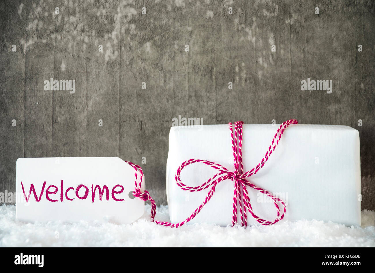 One White Gift With Label With English Text Welcome. Gray Grungy Cement ...