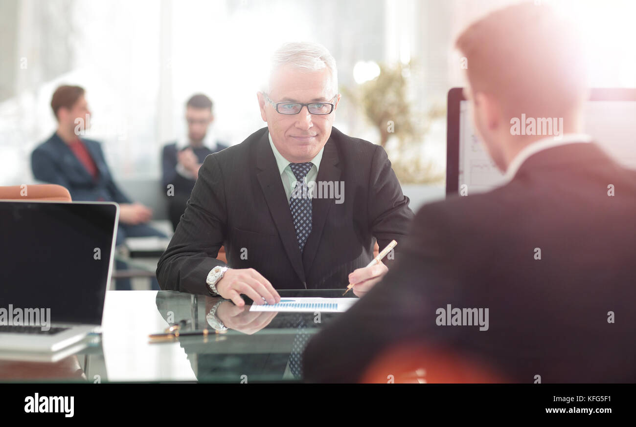 Two employees discussing electronic data at meeting Stock Photo - Alamy