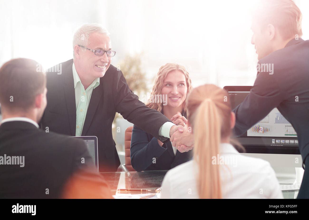 Business partners shaking hands after a successful transaction Stock ...