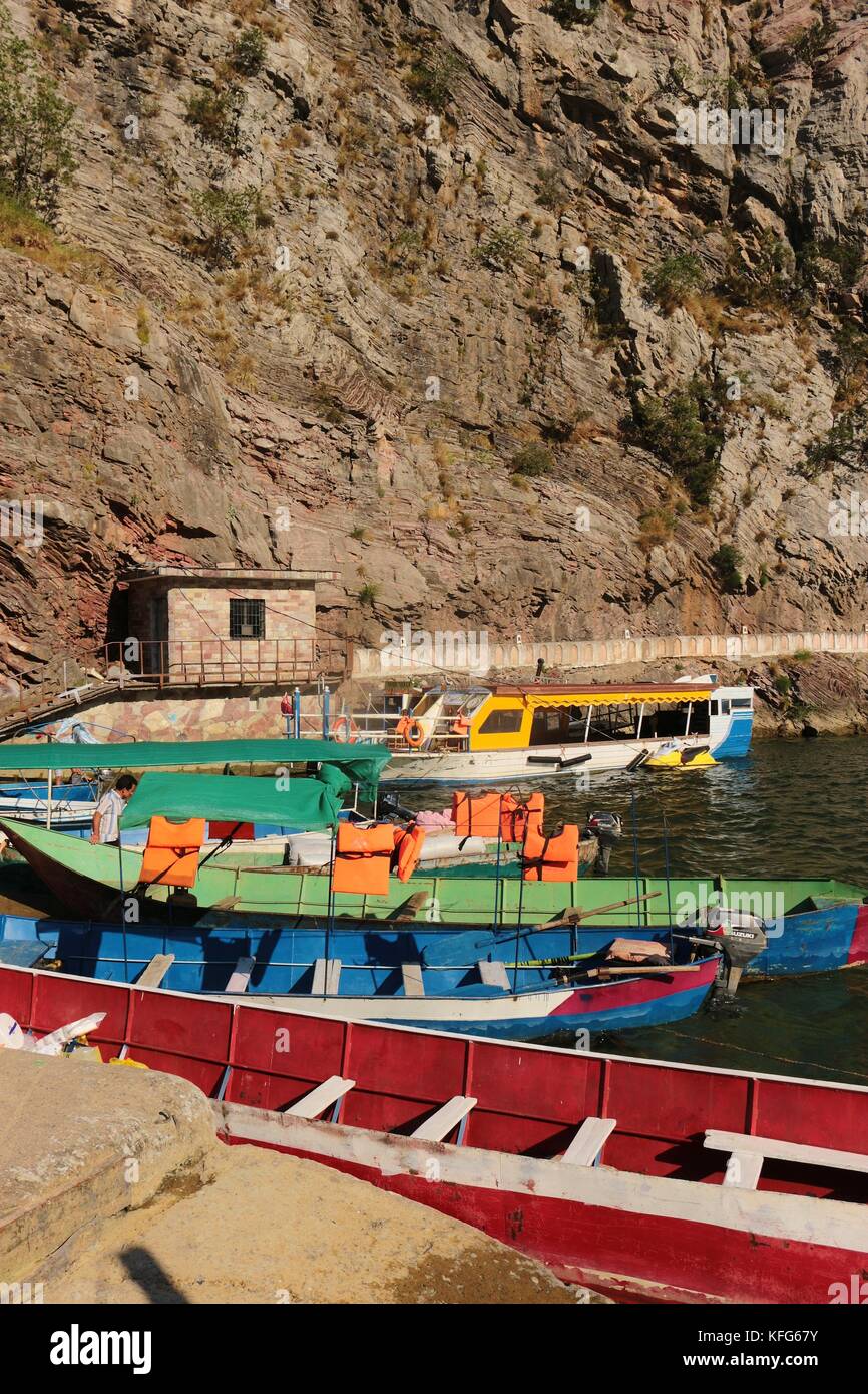Cliffs and boats on the ferry station in Koman, on Komani lake, 35 ...
