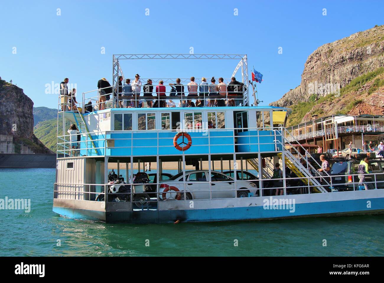 Boats on the ferry station in Koman, Komani lake, 35 kilometers long ...