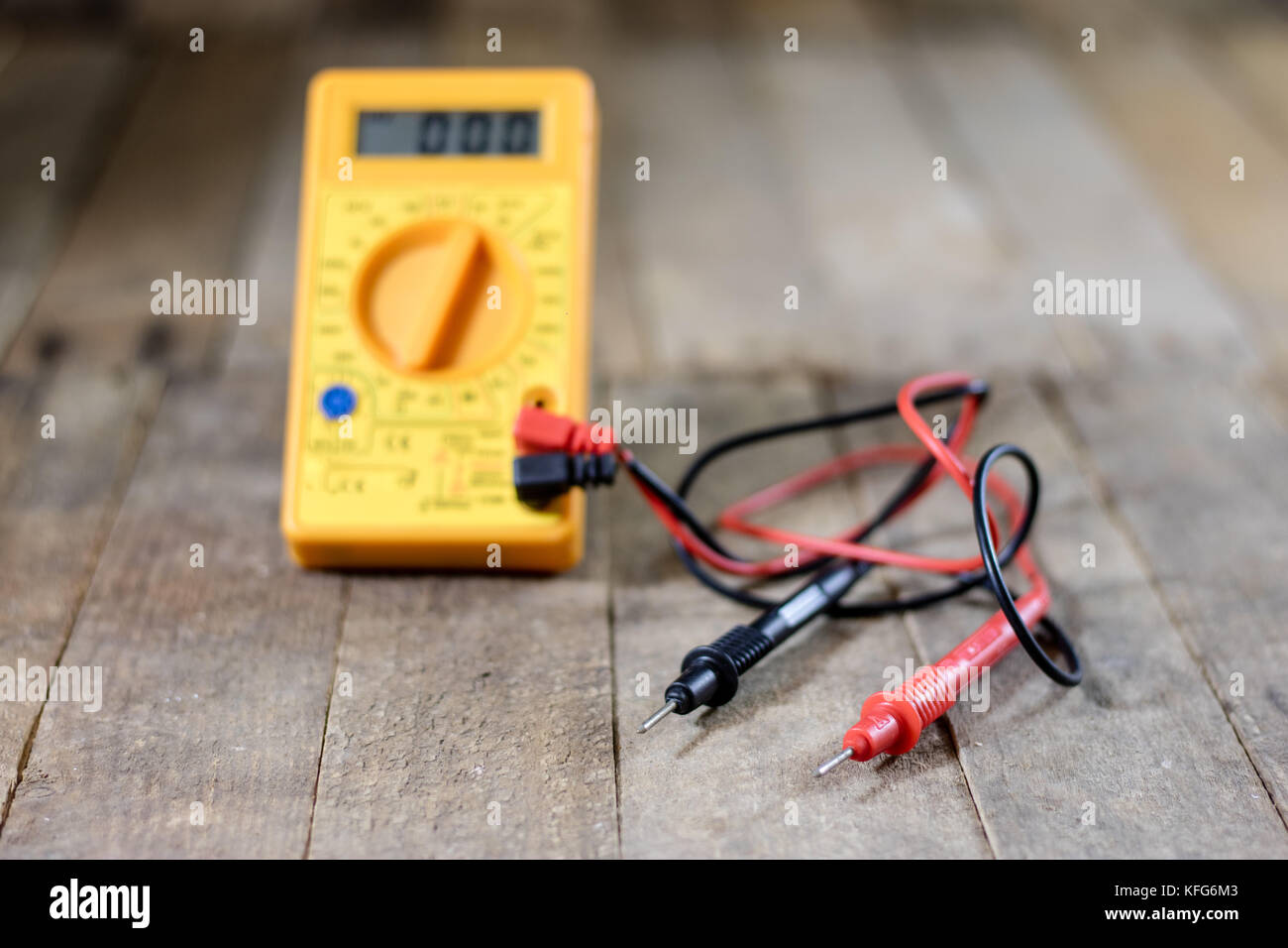 Electronic workshop. Electric meter and soldering iron Stock Photo - Alamy