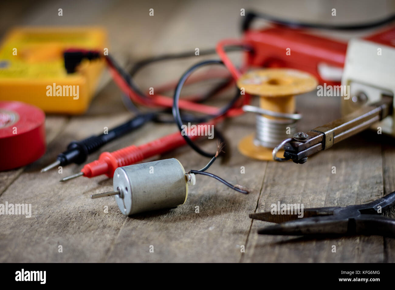 Electronic workshop. Electric meter and soldering iron Stock Photo - Alamy