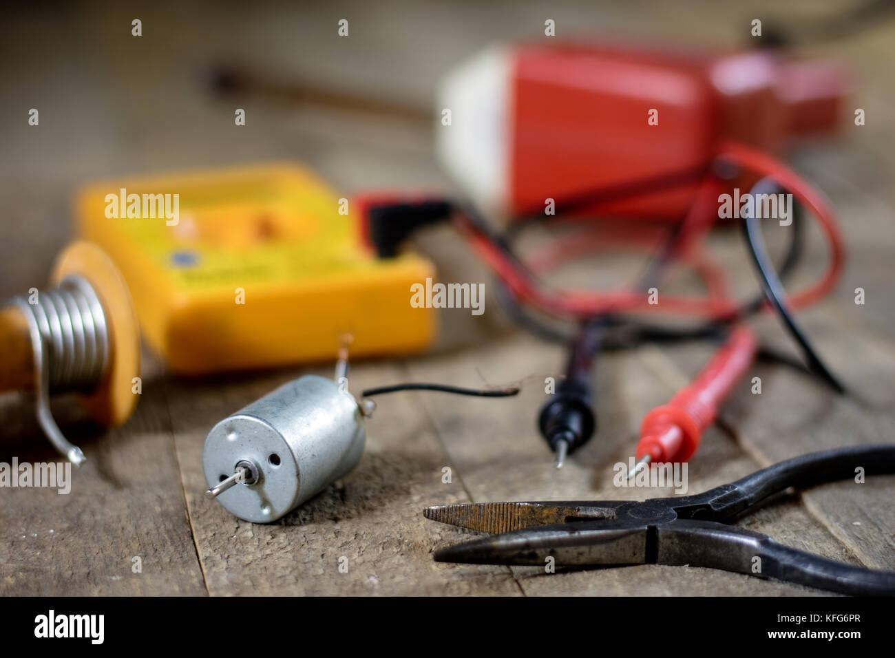 Electronic workshop. Electric meter and soldering iron Stock Photo - Alamy