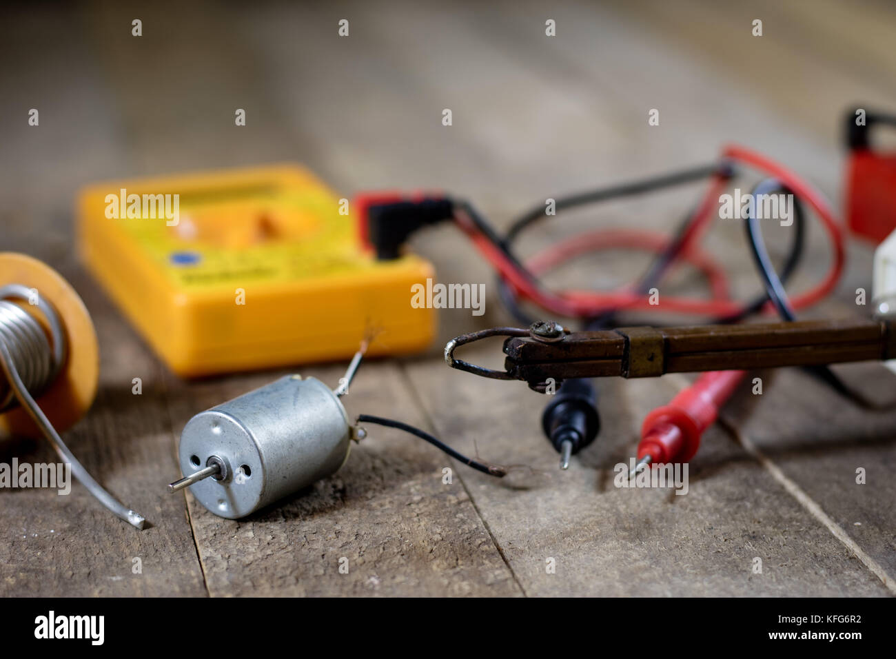 Electronic workshop. Electric meter and soldering iron Stock Photo - Alamy