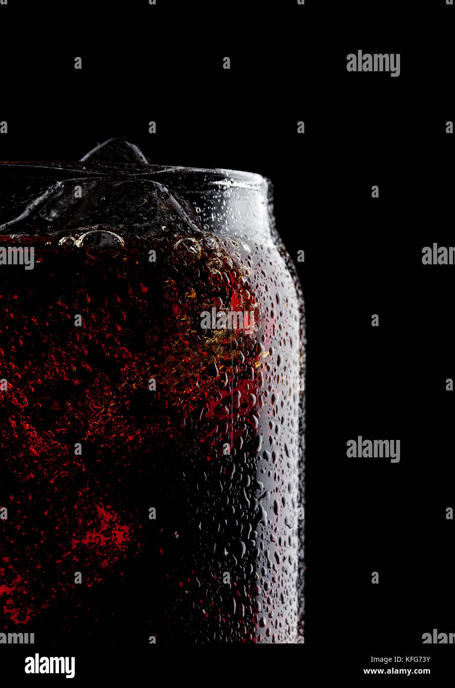 Glass of cold cola soda drink with ice cubes on black background. Macro with dew drops Stock ...