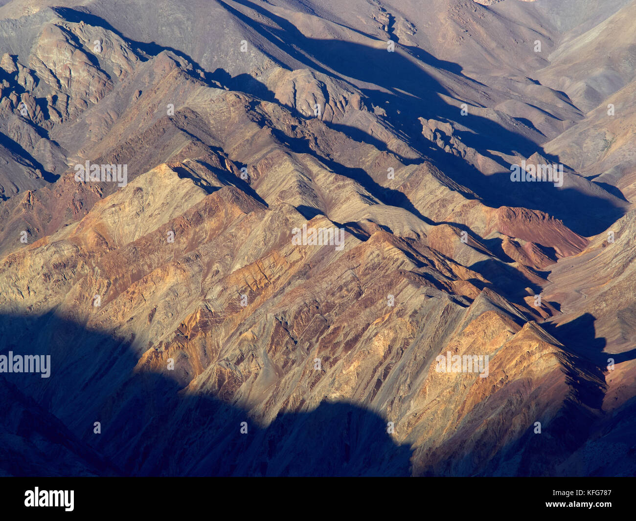 Slopes of mountains of different colors: orange red, burgundy yellow ...