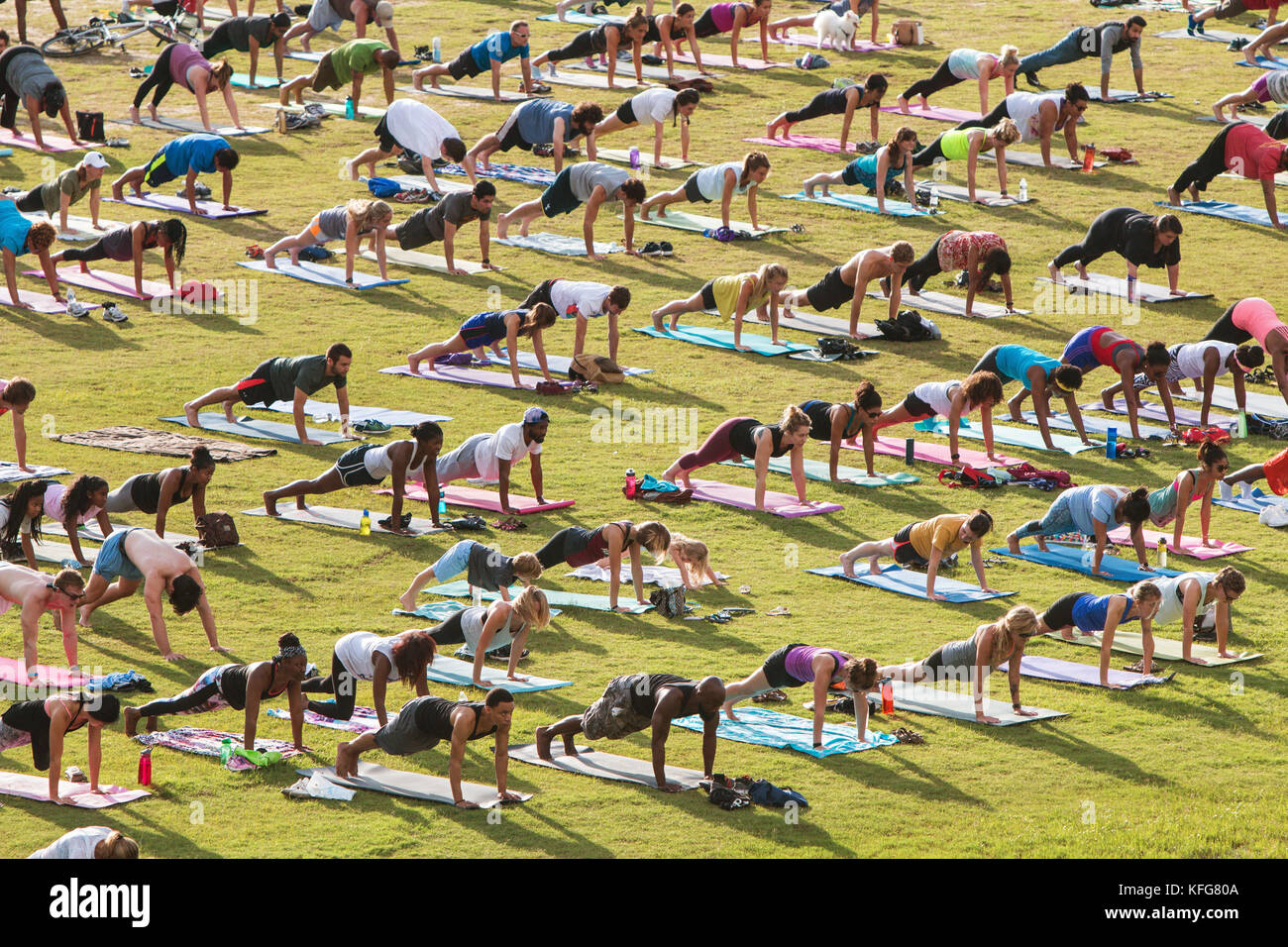 Atlanta, GA, USA - July 2, 2017: Dozens of people do the plank pose as ...