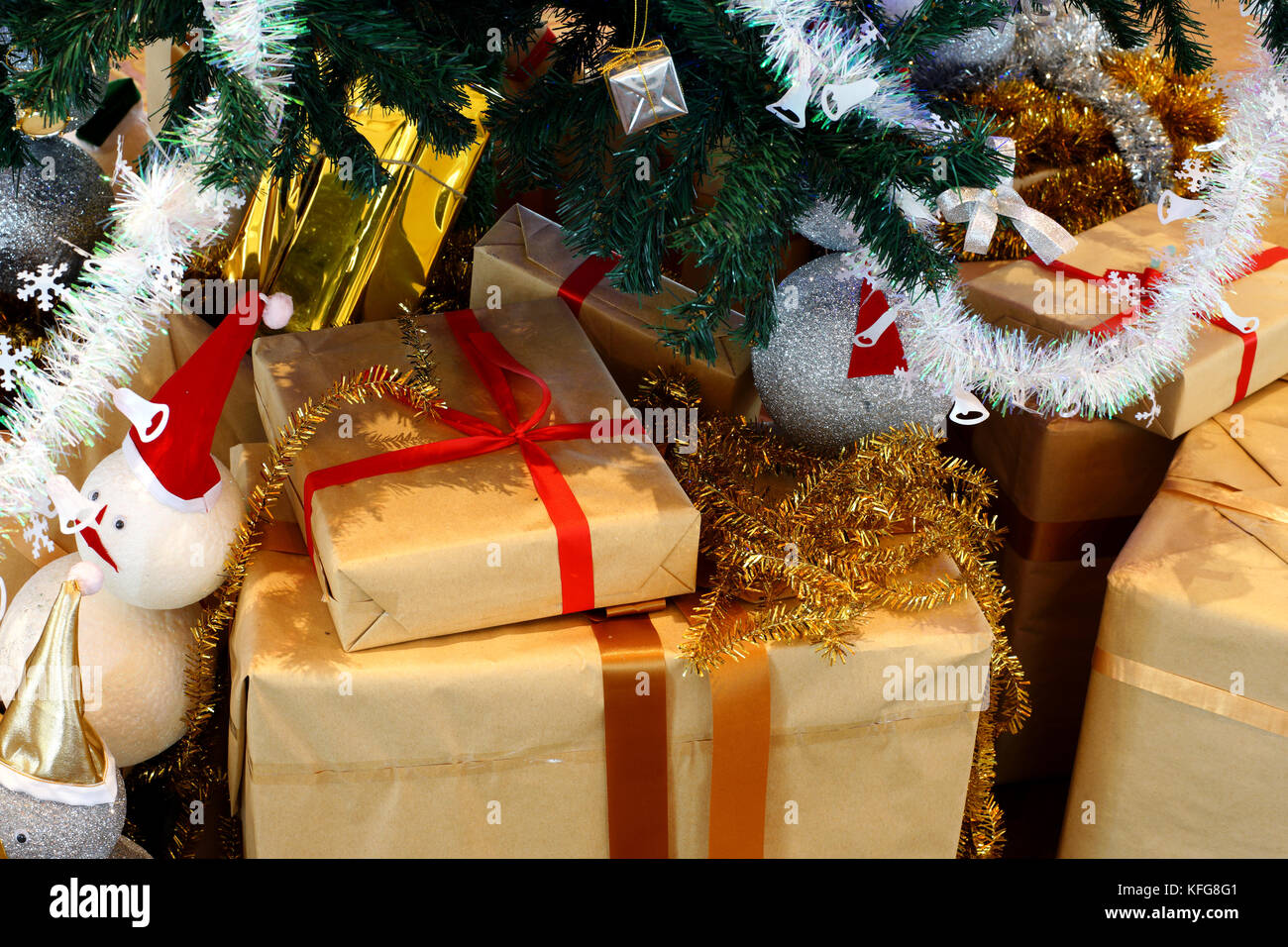 pile of gift boxes under the christmas tree Stock Photo - Alamy