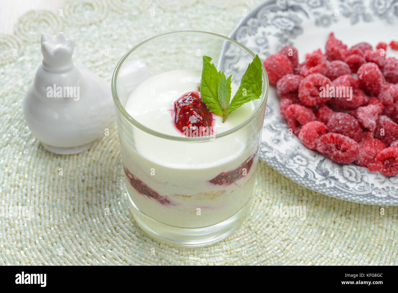 Raspberry cream dessert in clear glass on table Stock Photo - Alamy