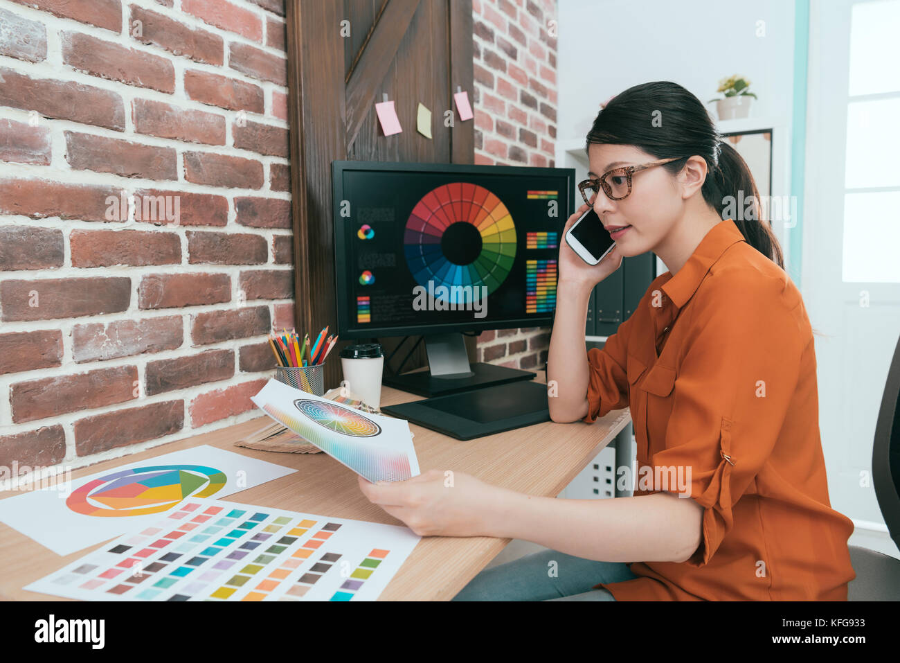 elegant beauty girl designer looking at graphic craft sketch and using ...