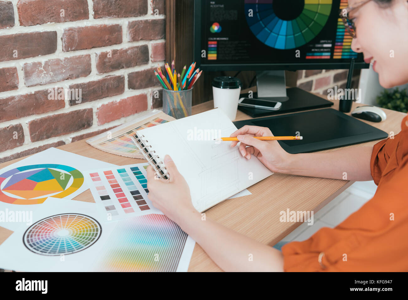 smiling professional woman artist using pencil drawing graph with many ...