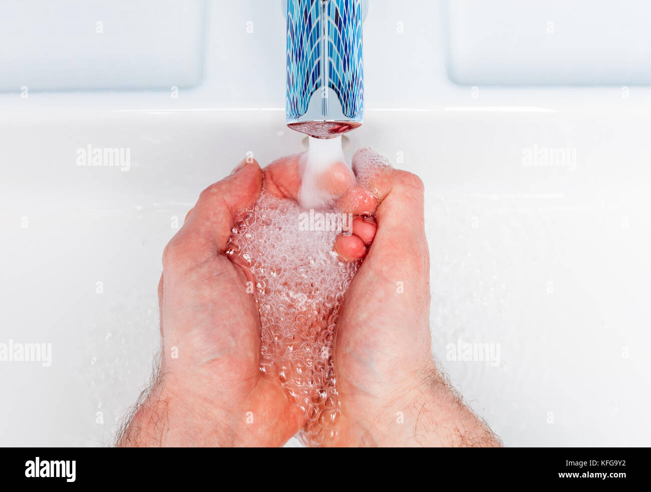 Man washing hands in basin hi-res stock photography and images - Alamy