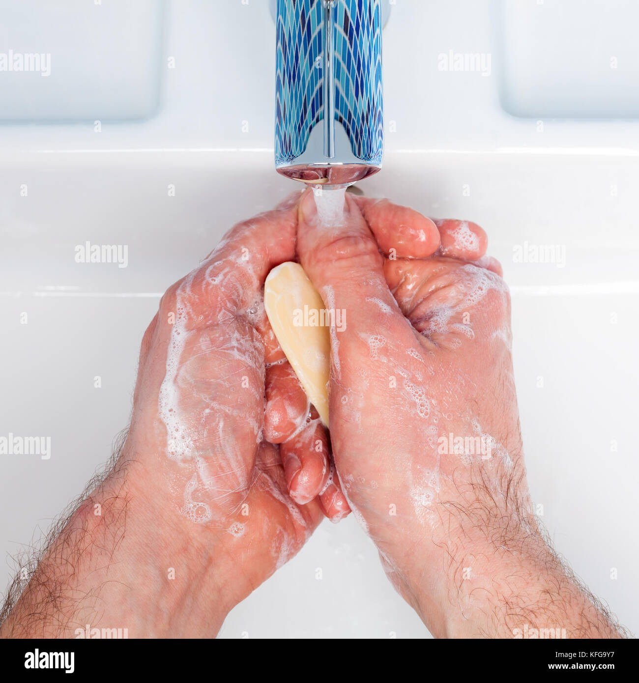 Man washing his hands with soap Stock Photo - Alamy