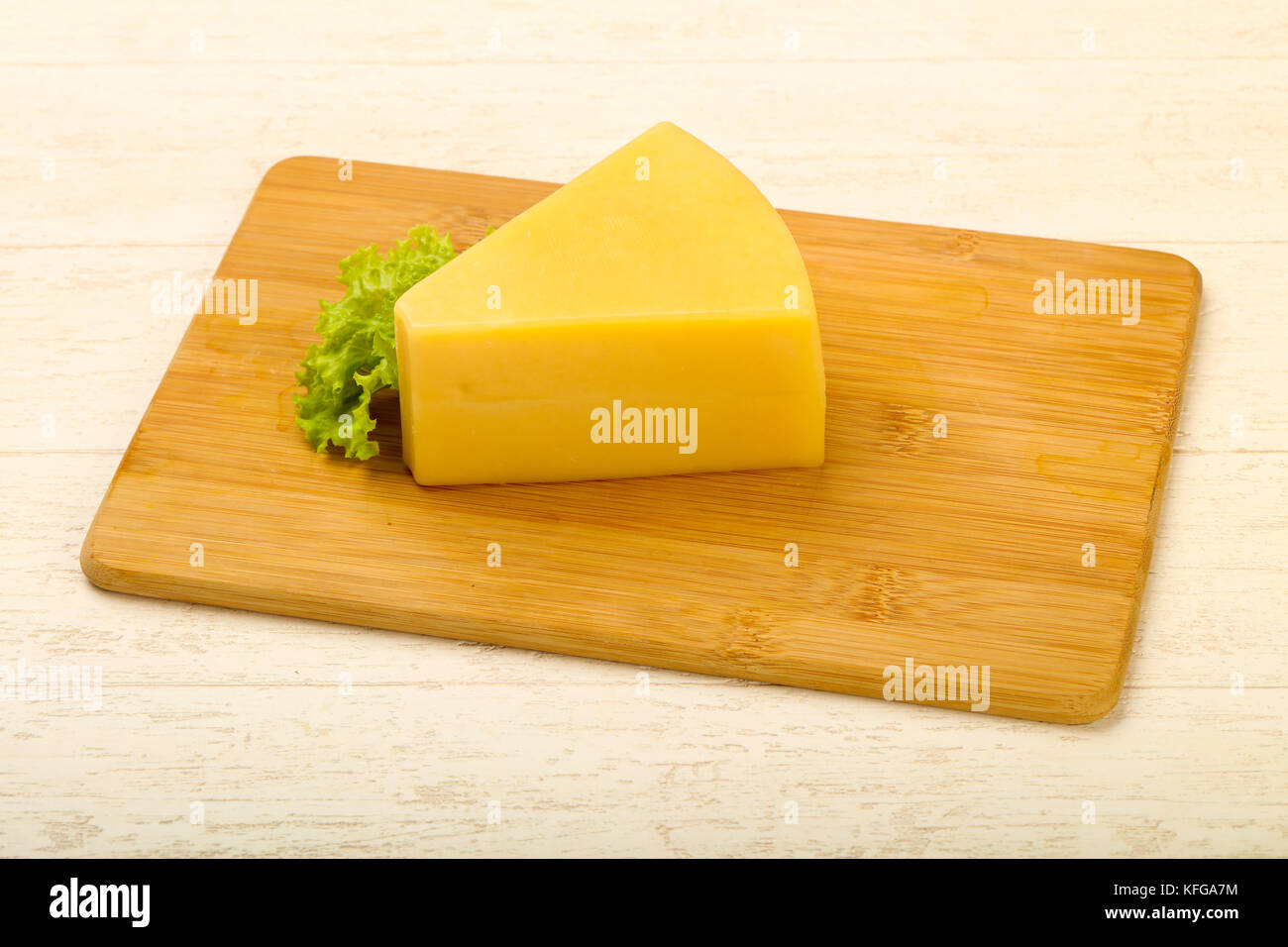 Parmesan cheese triangle Stock Photo - Alamy